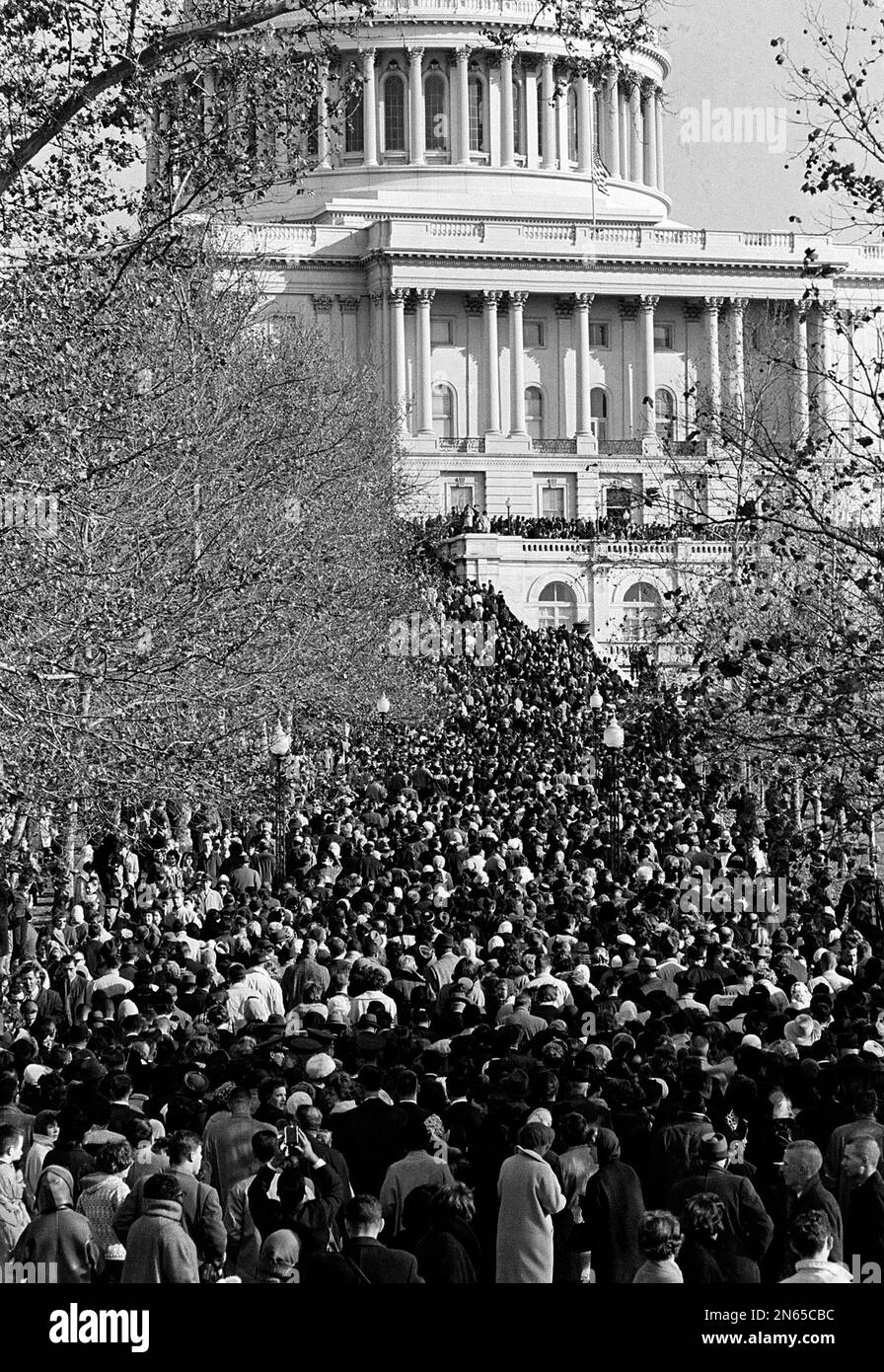 FILE - In this Sunday, Nov. 24, 1963 file photo, mourners form a long ...