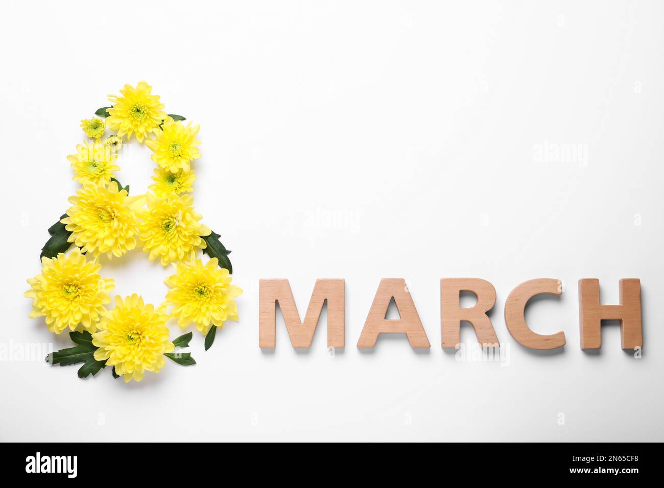 8 March greeting card design with chrysanthemum flowers and wooden ...