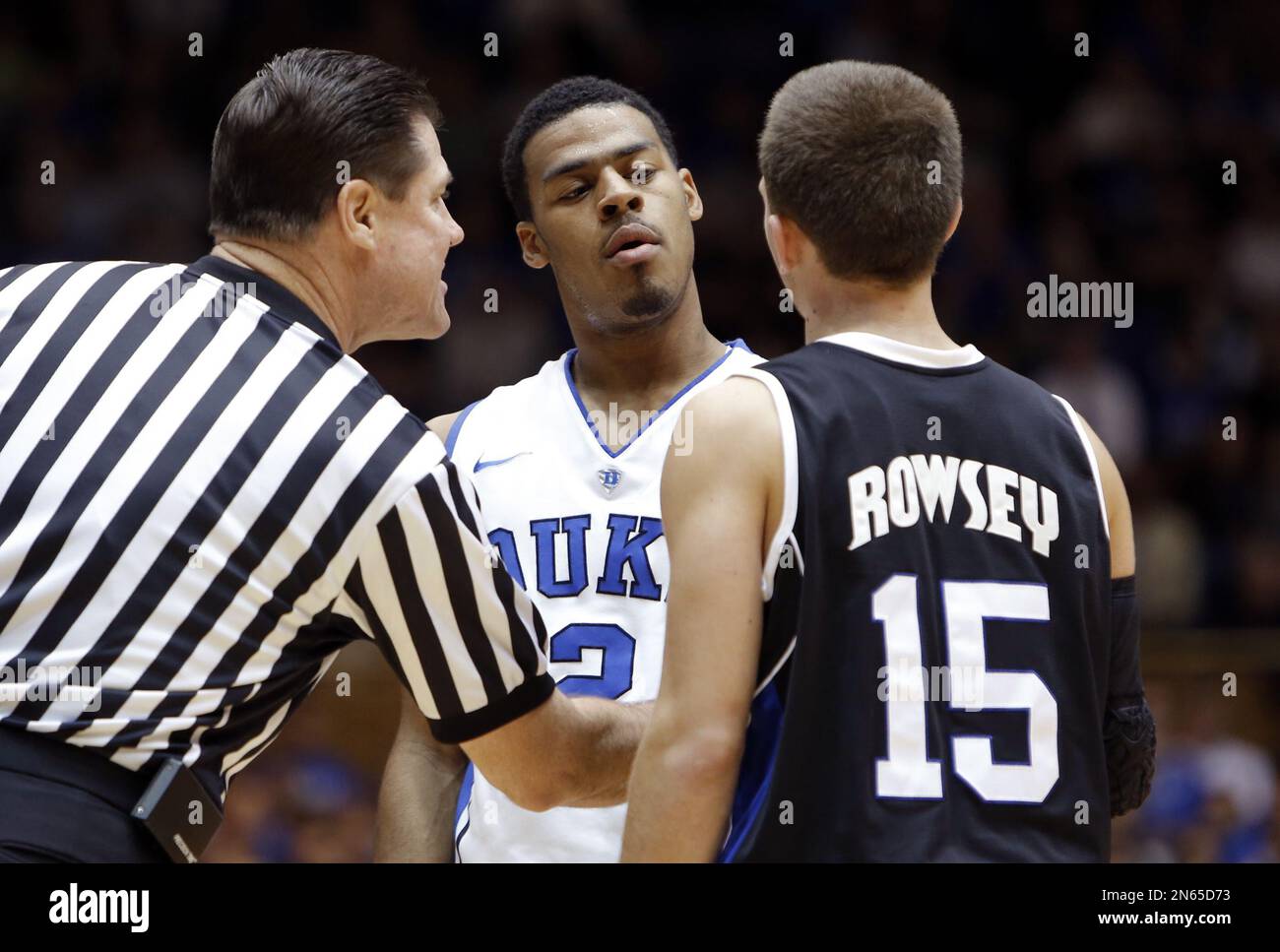 Duke's Quinn Cook stares down UNC-Asheville's Andrew Rowsey (15) after ...