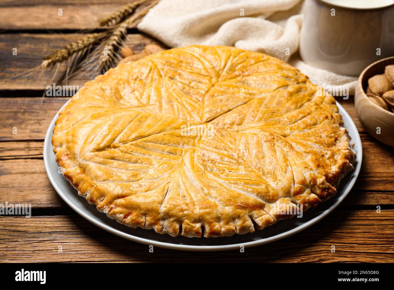 Traditional galette des rois on wooden table Stock Photo - Alamy