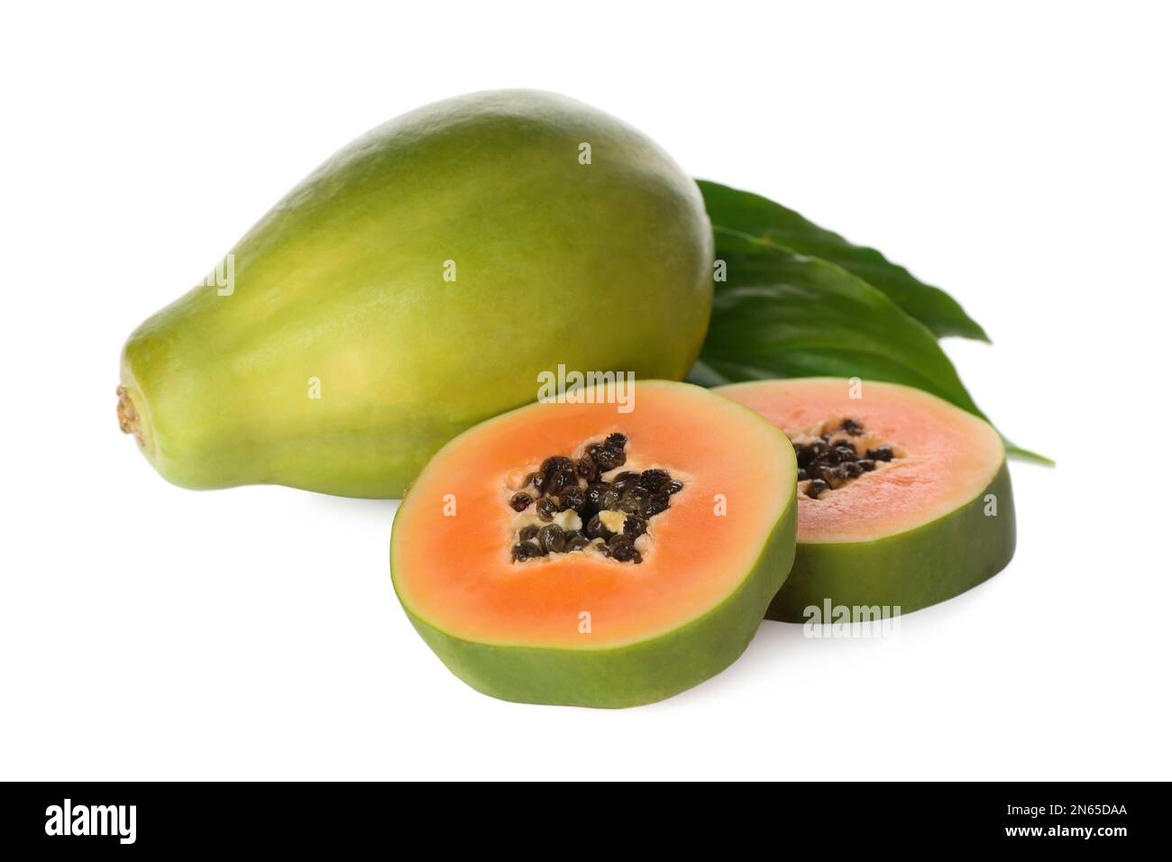 Fresh ripe papaya fruits with green leaves on white background Stock ...
