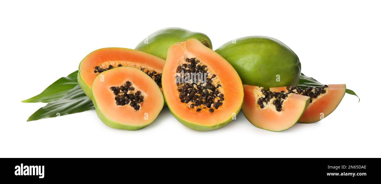 Fresh ripe papaya fruits with green leaves on white background Stock ...