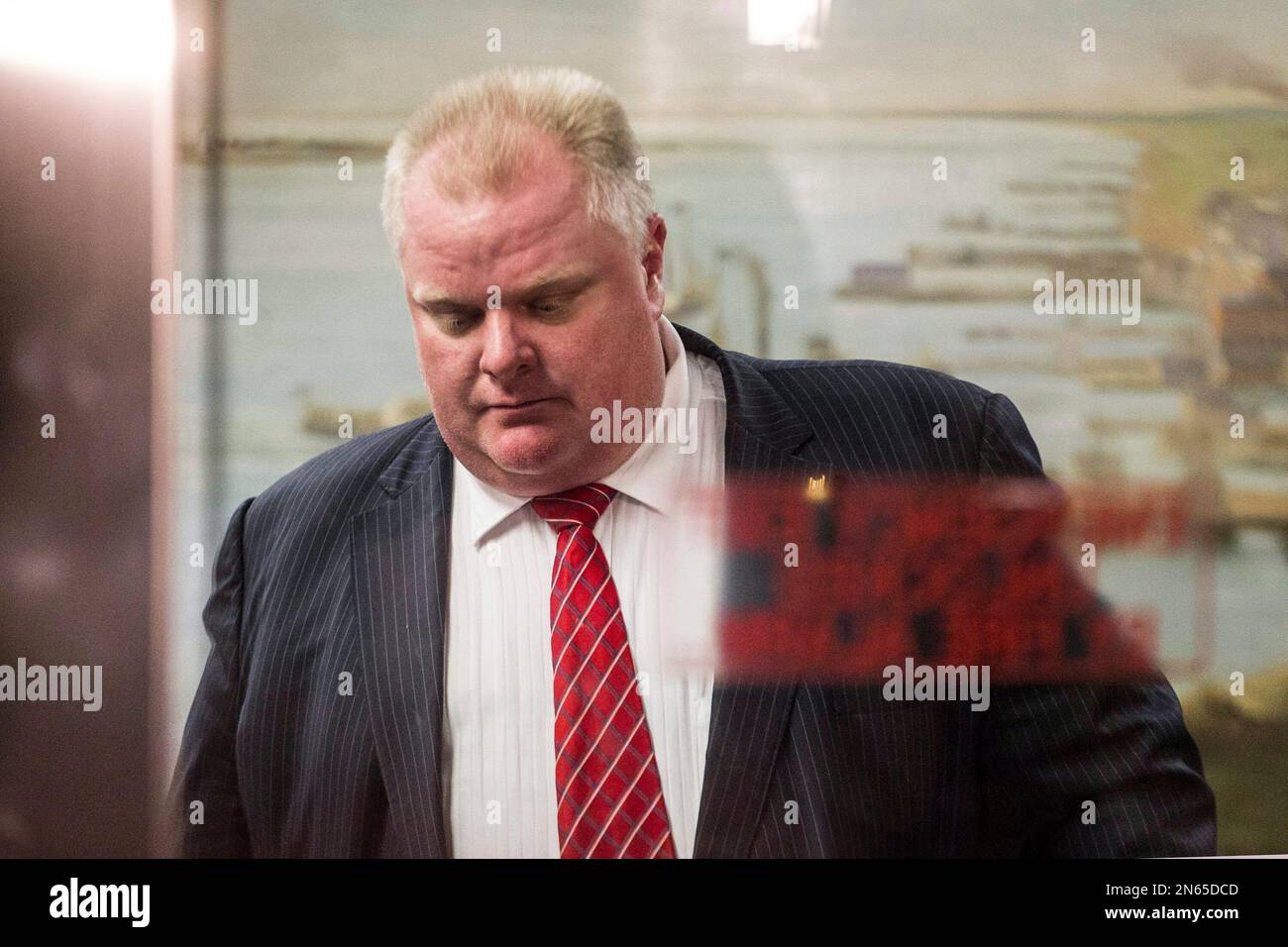 Toronto Mayor Rob Ford leaves city hall for the day after councillors ...
