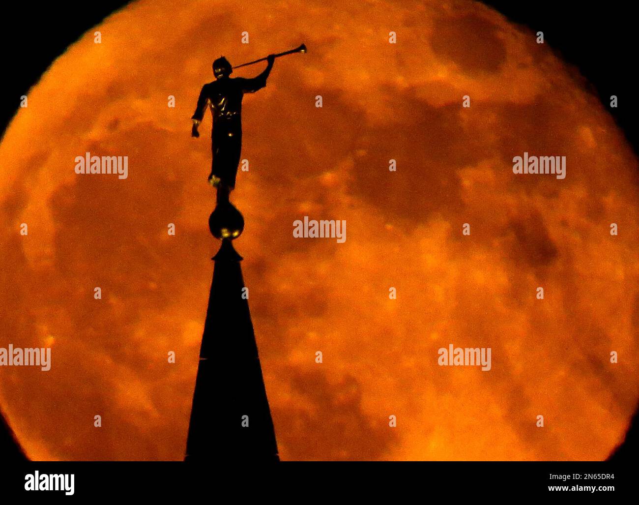 A statue of the Angel Moroni on top of a Latter-day Saints temple is ...