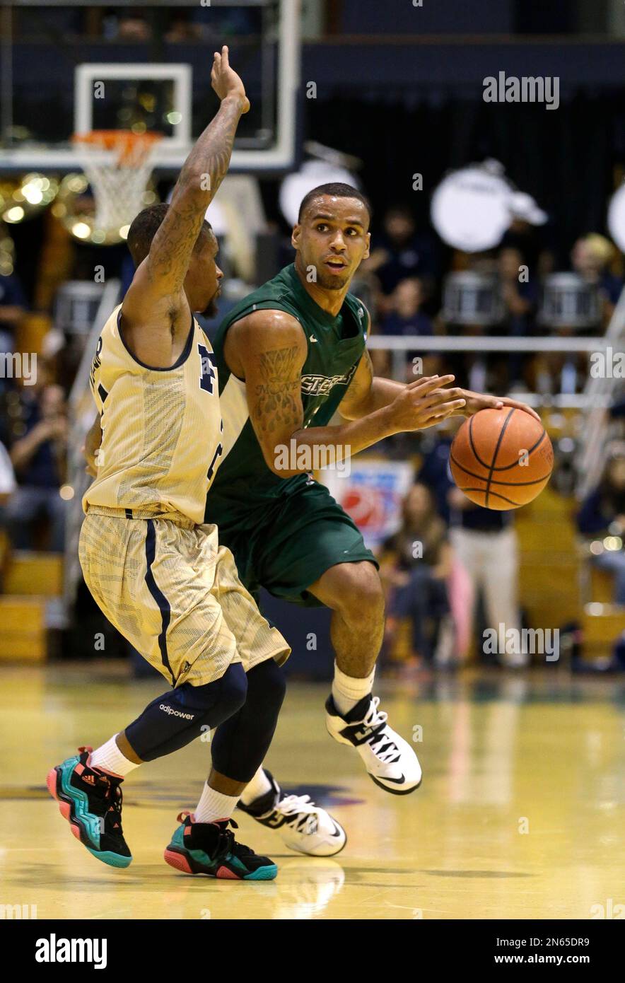 Stetson guard Raymone Andrews, right, drives past Florida International ...