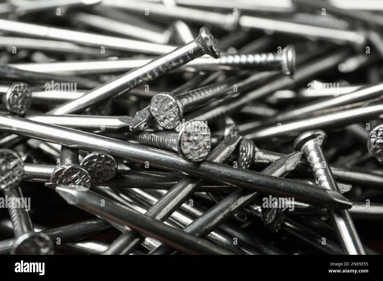 Pile of metal nails as background, closeup Stock Photo - Alamy