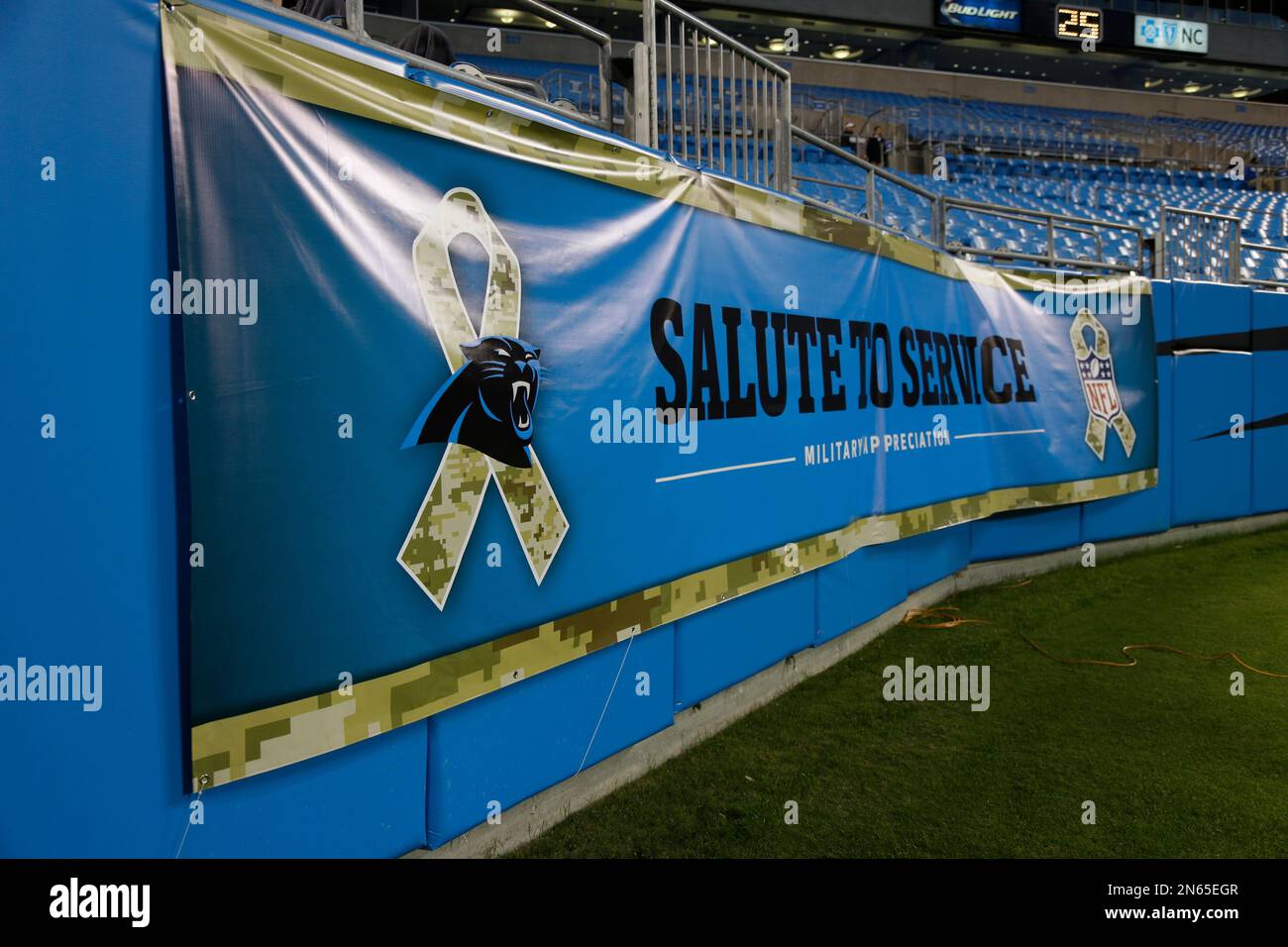A banner with a Salute to Service for the military is shown before an ...