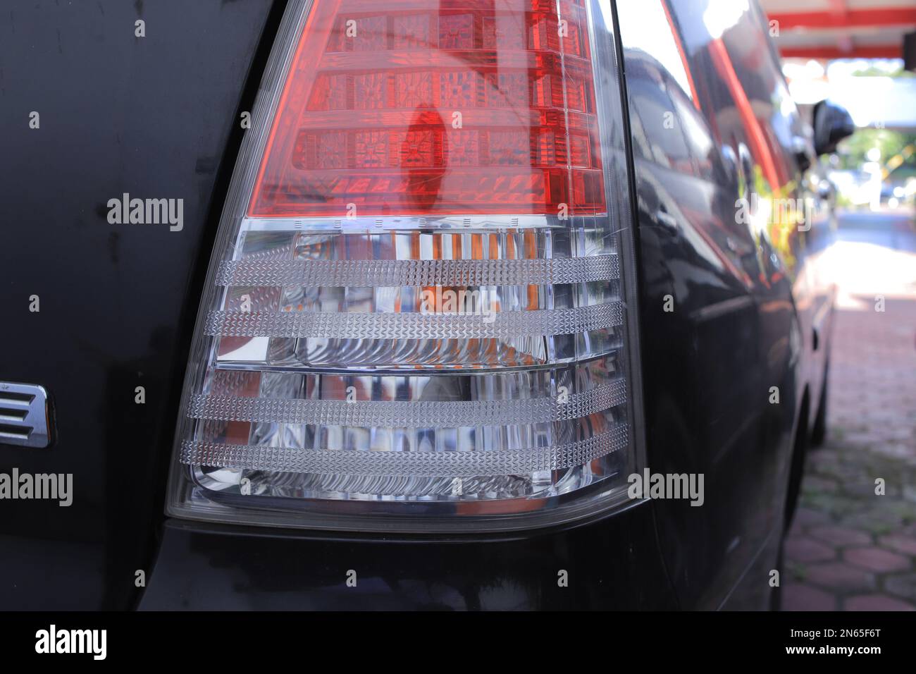 Back light of city car on the street background Stock Photo - Alamy