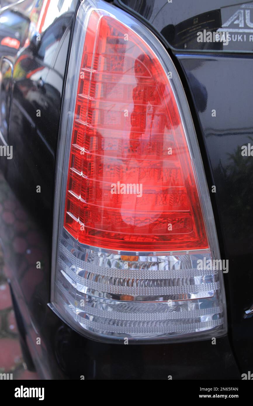 Back light of city car on the street background Stock Photo - Alamy