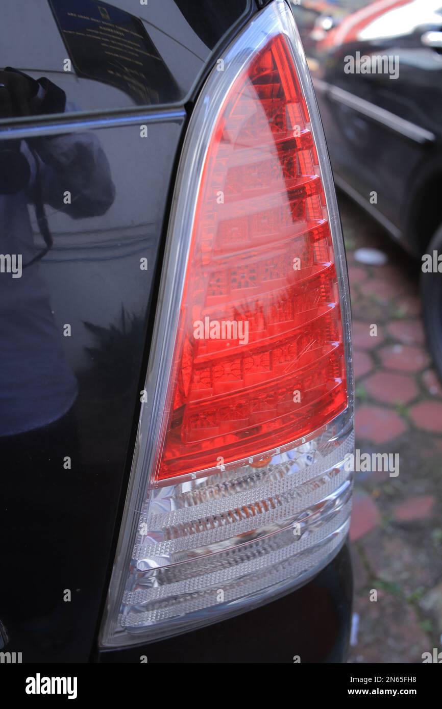 Back light of city car on the street background Stock Photo - Alamy