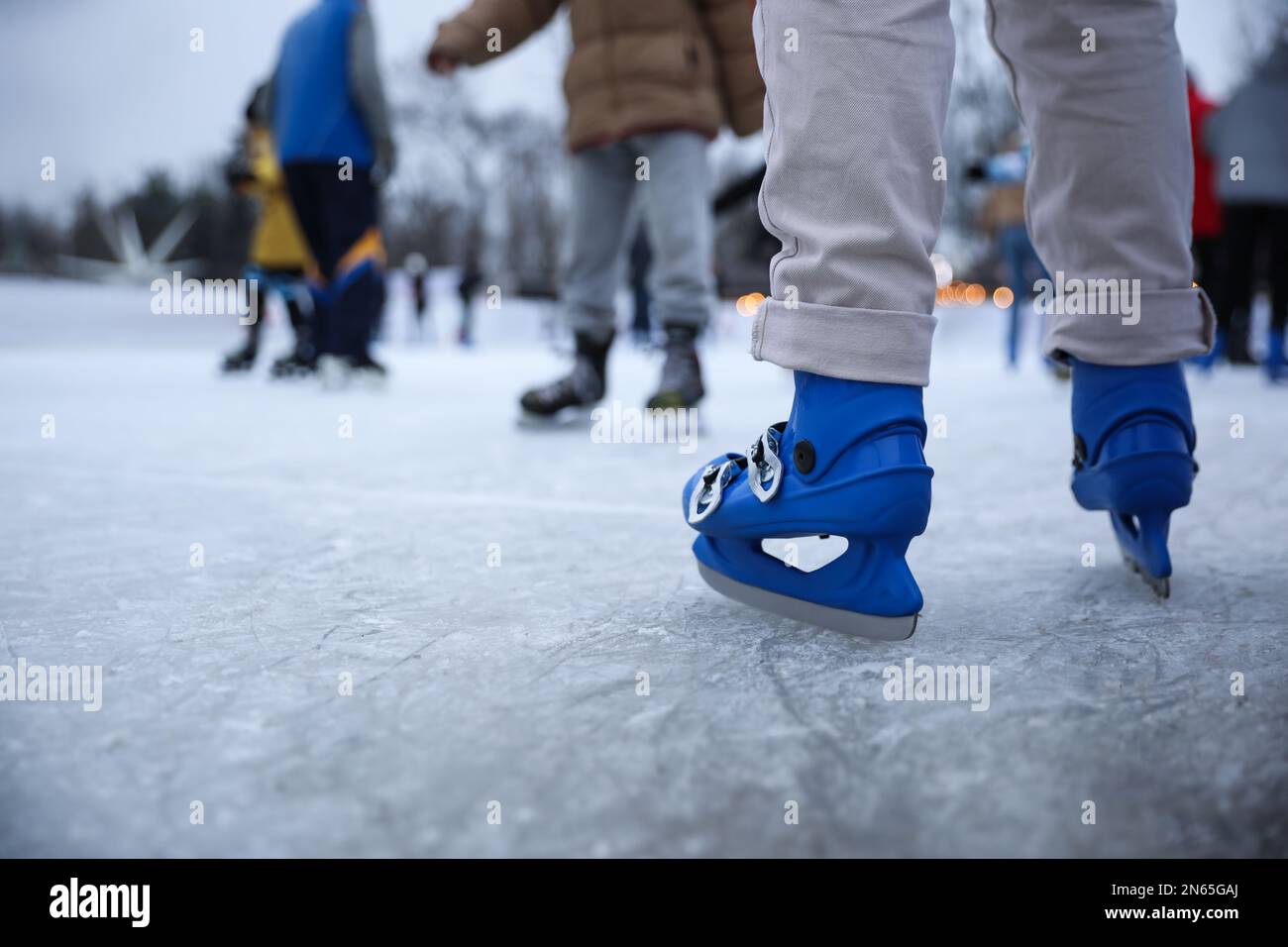 Person skating at outdoor ice rink, closeup Stock Photo - Alamy