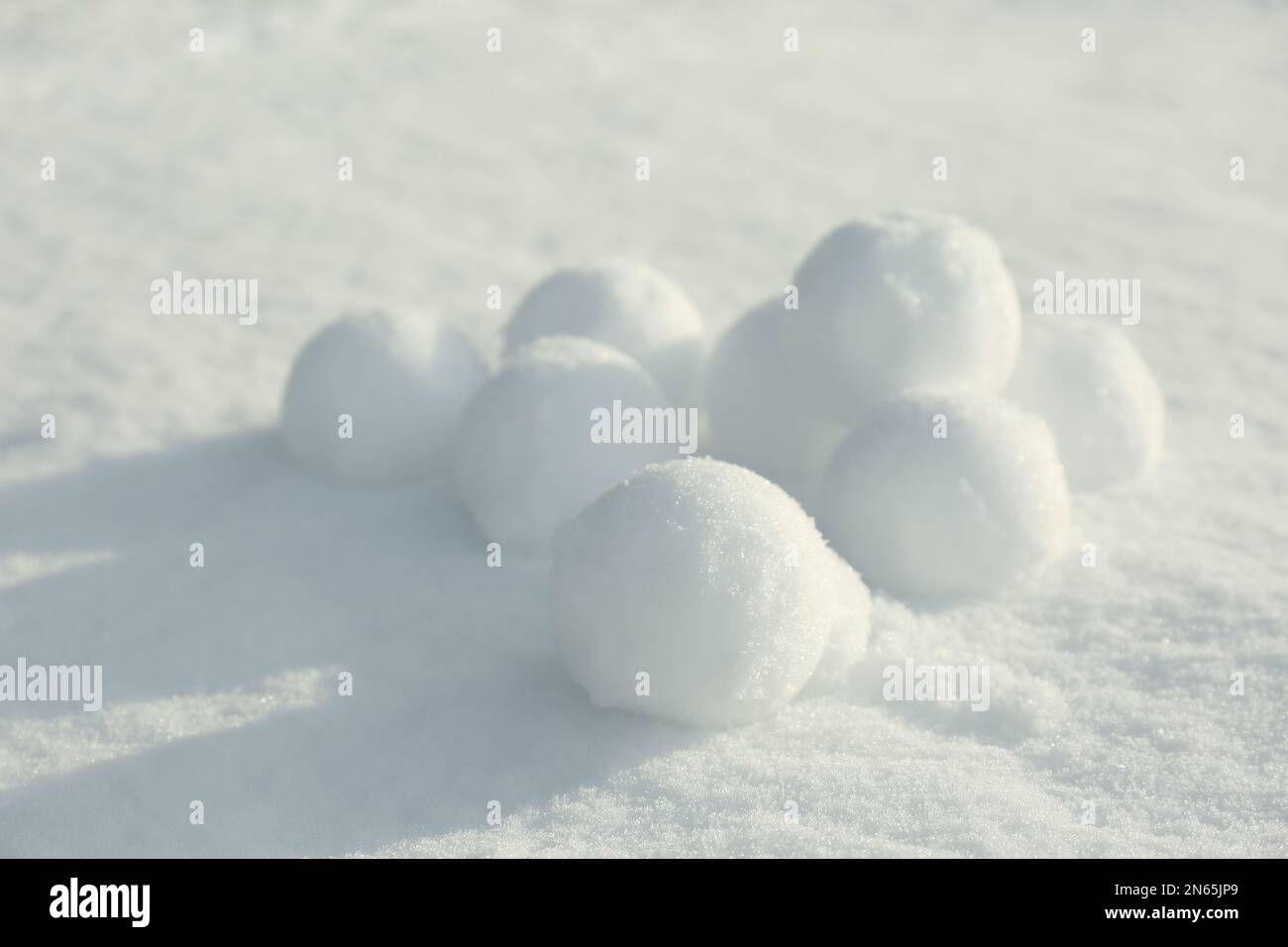 Pile of perfect round snowballs on snow outdoors Stock Photo - Alamy