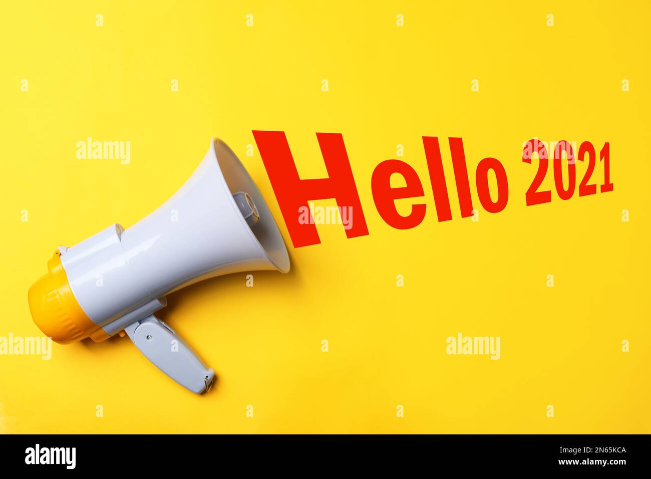 Hello 2021. Megaphone on yellow background, top view Stock Photo - Alamy