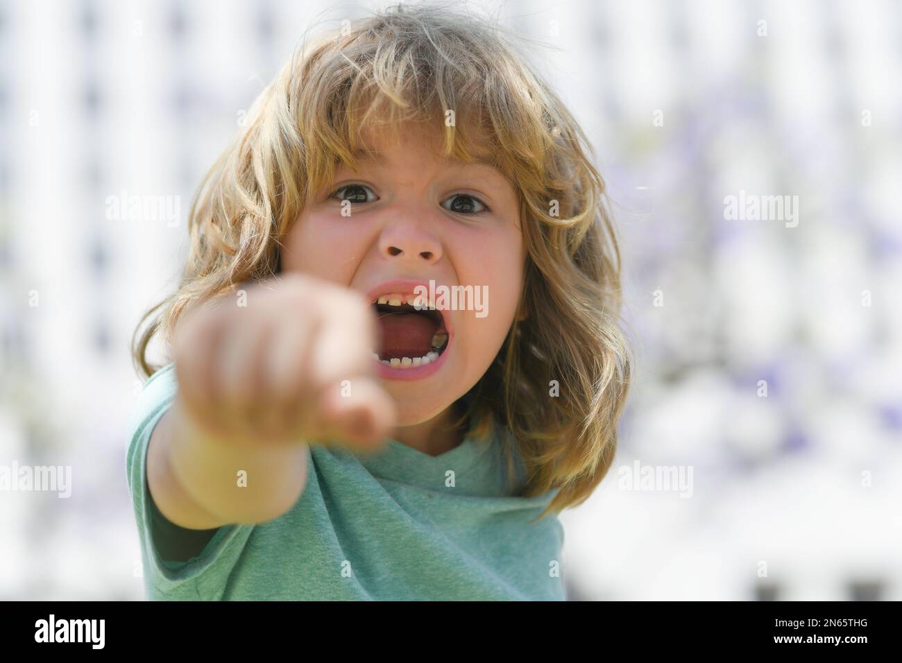 Boy fight with fist gesture punch. Kid boy with angry expression. Angry ...