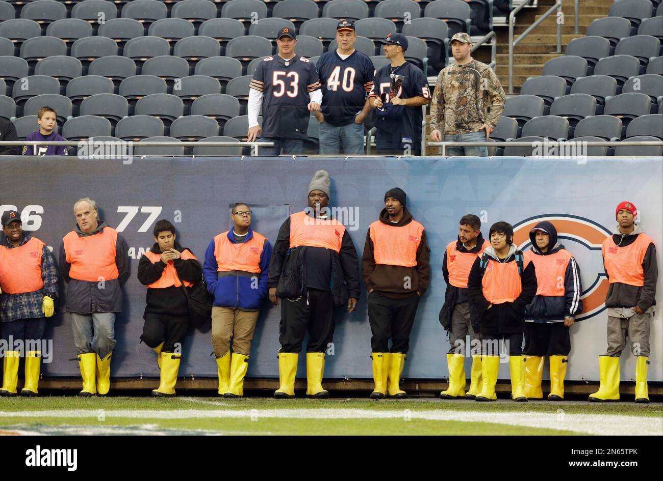 Soldier Field groundskeepers line up against the wall and a few Chicago ...