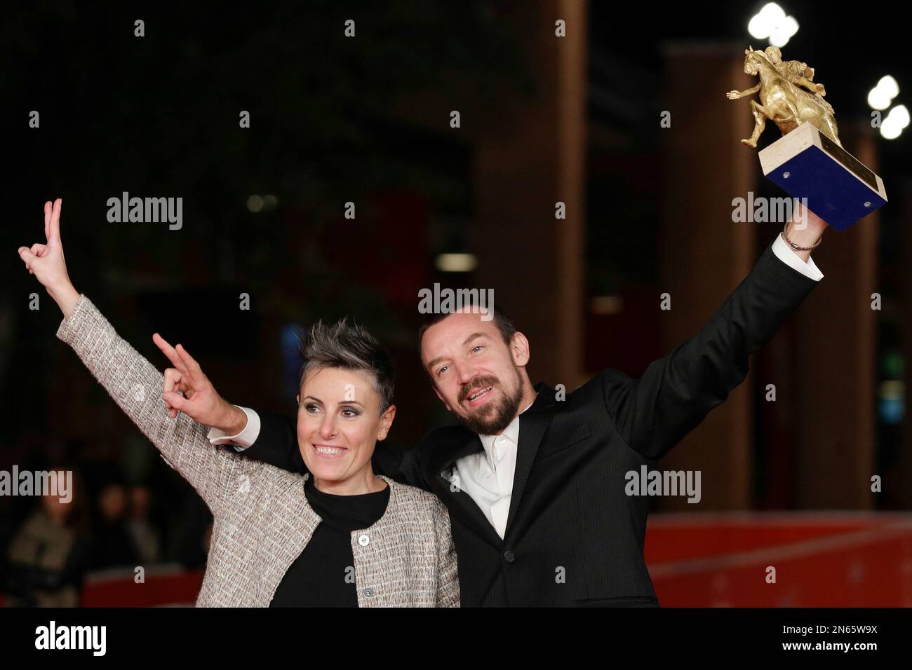Director Alberto Fasulo, right, holding the Golden Marc’Aurelio Award ...