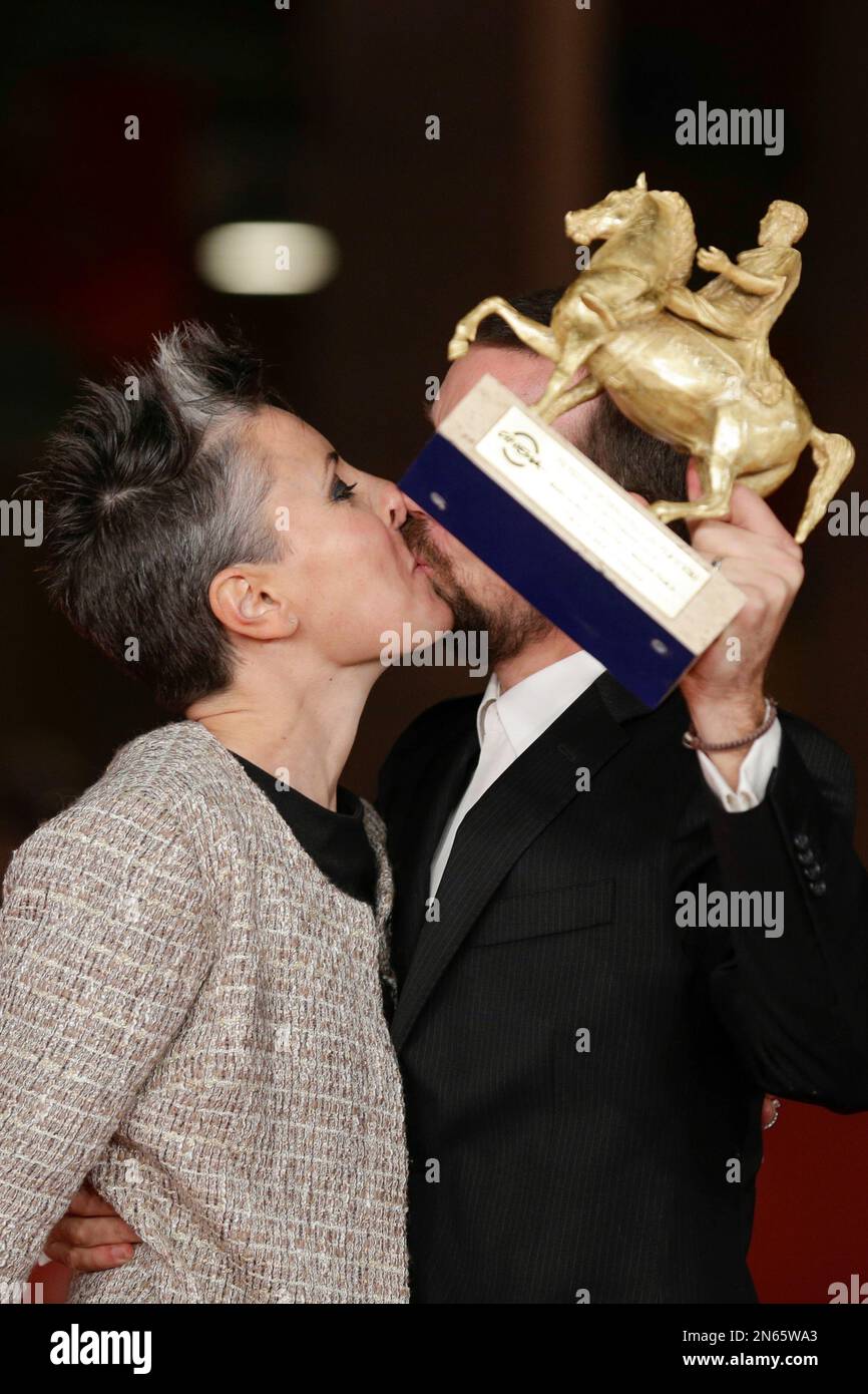 Director Alberto Fasulo, right, kisses his wife producer Nadia Trevisan ...