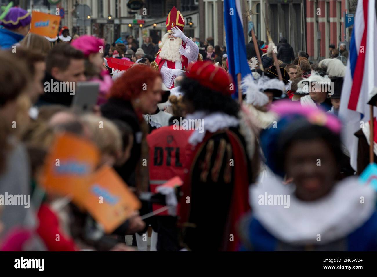 Spectators watch the arrival of Sinterklaas, the Dutch version of Santa ...