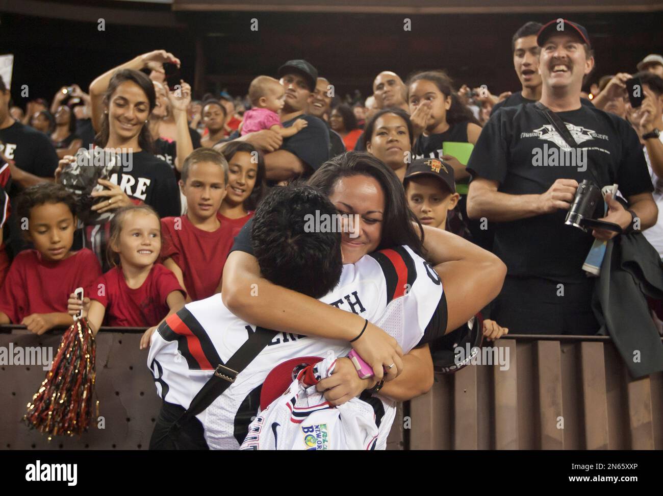 San Diego State defensive lineman Sam Meredith gets hug after his team ...