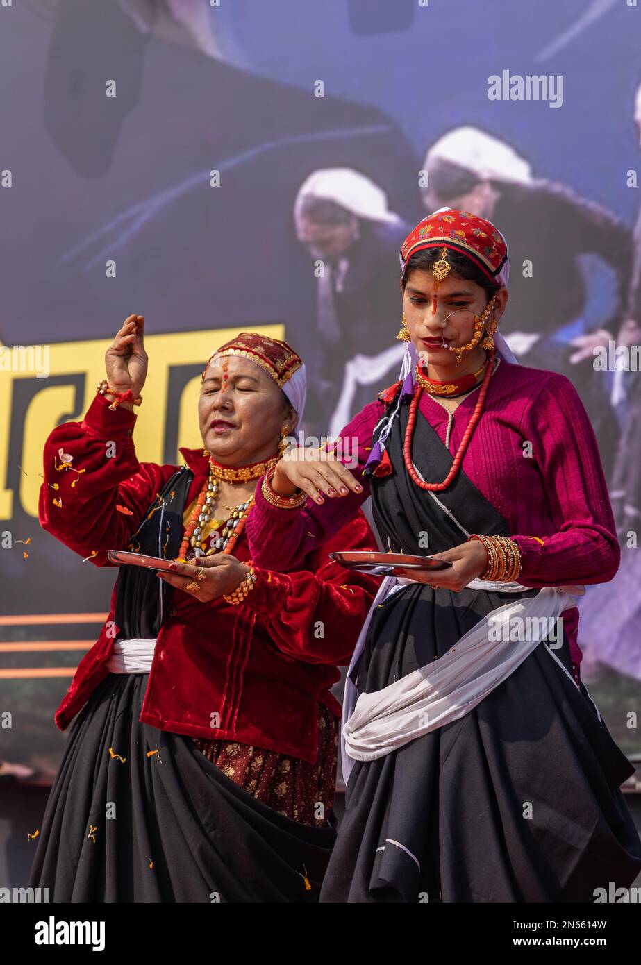 Tribal women of Uttarakhand wearing traditional attire dancing in their ...