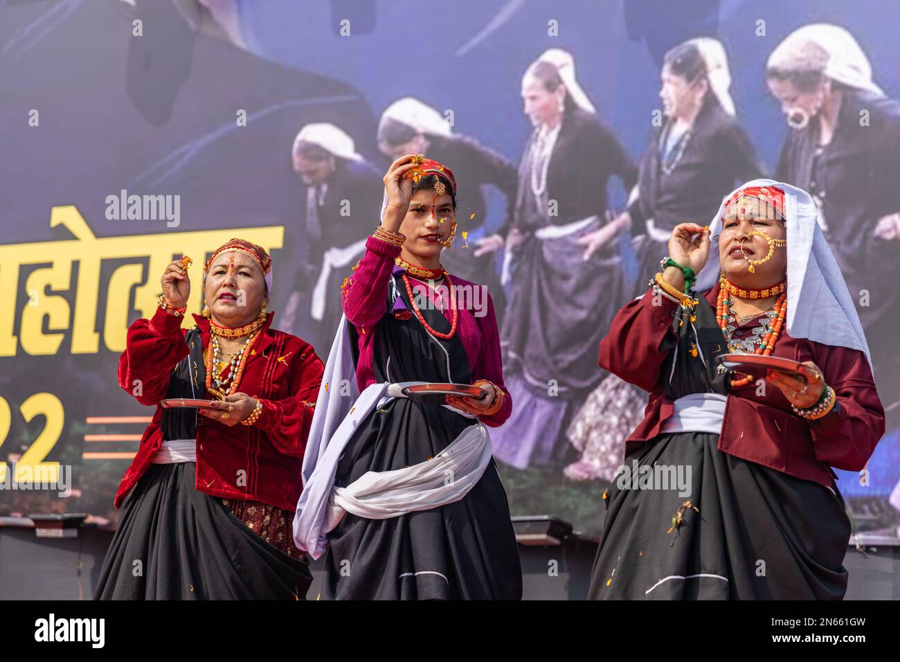 Tribal women of Uttarakhand wearing traditional attire dancing in their ...