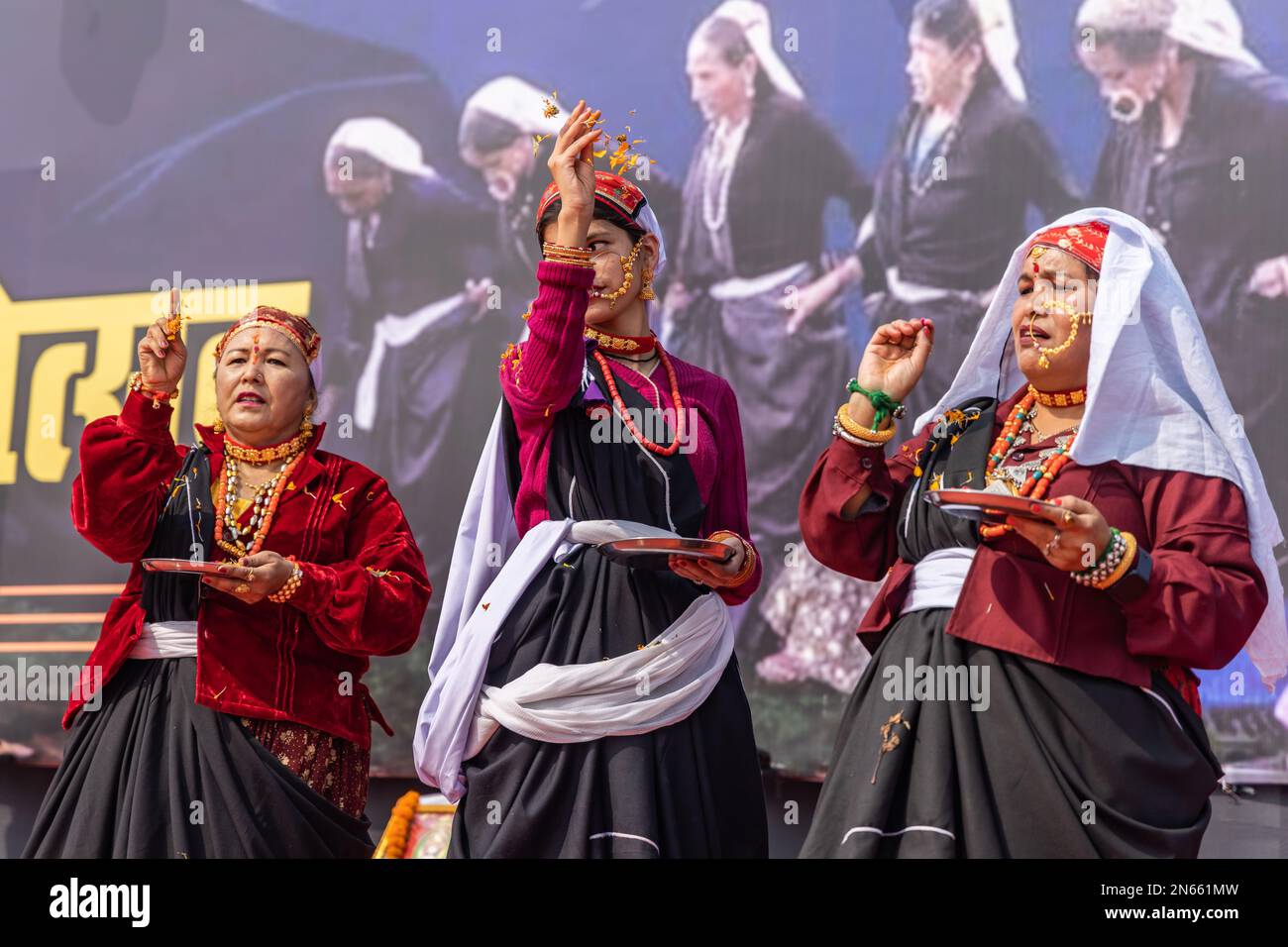 Tribal women of Uttarakhand wearing traditional attire dancing in their ...
