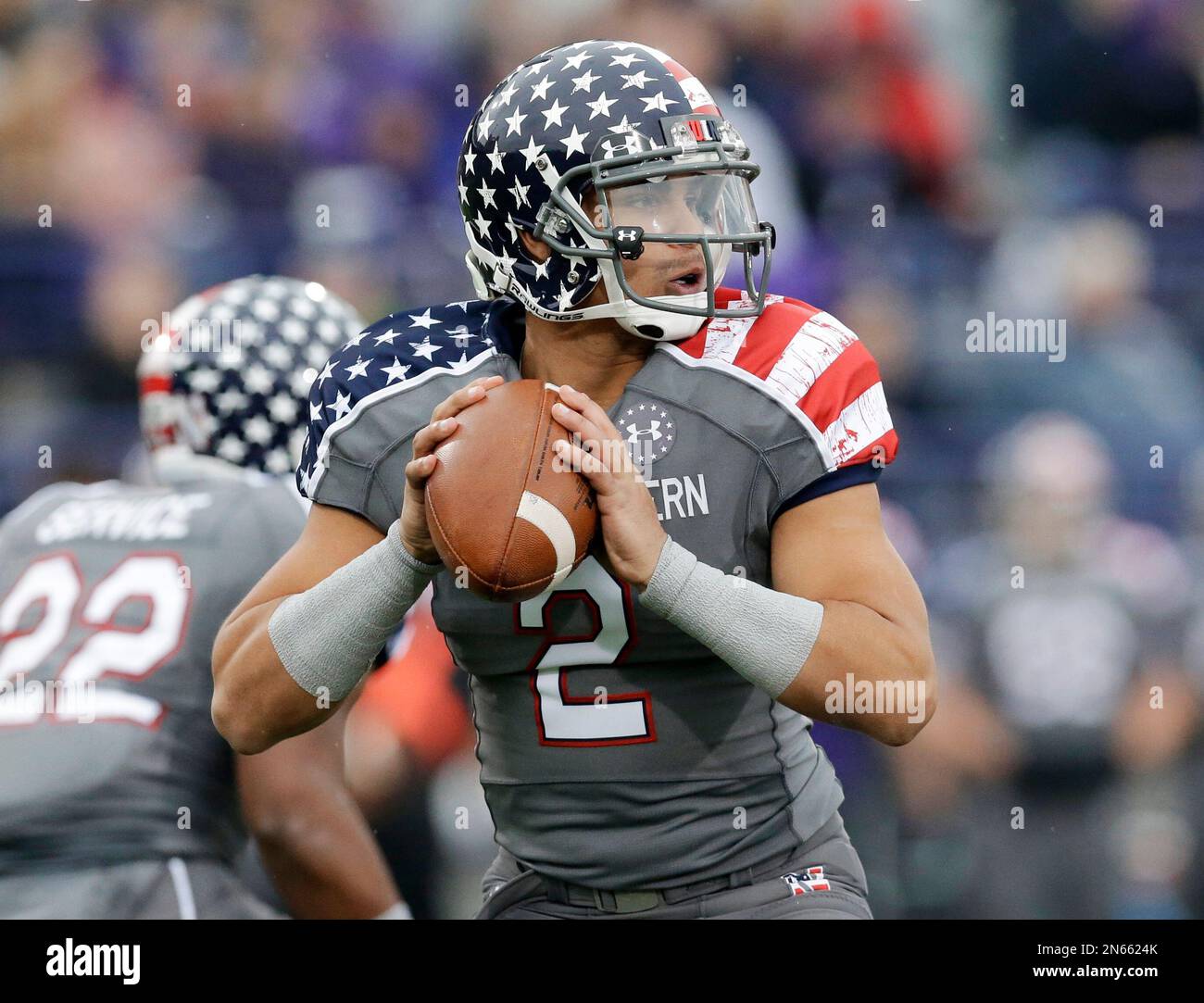 Northwestern quarterback Kain Colter looks to pass during the first ...