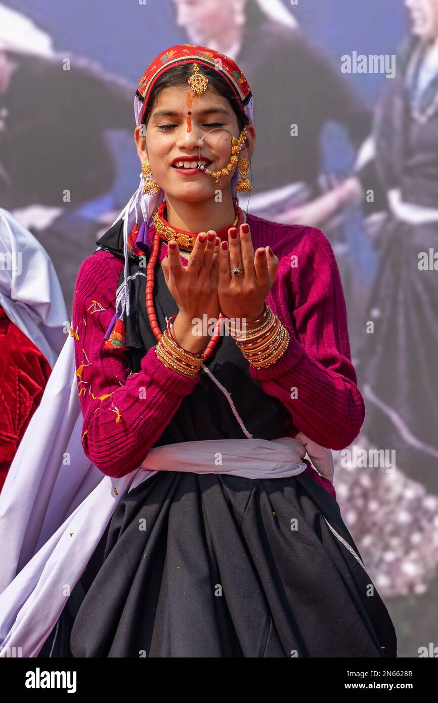 A Tribal woman of Uttarakhand wearing traditional attire dancing in ...