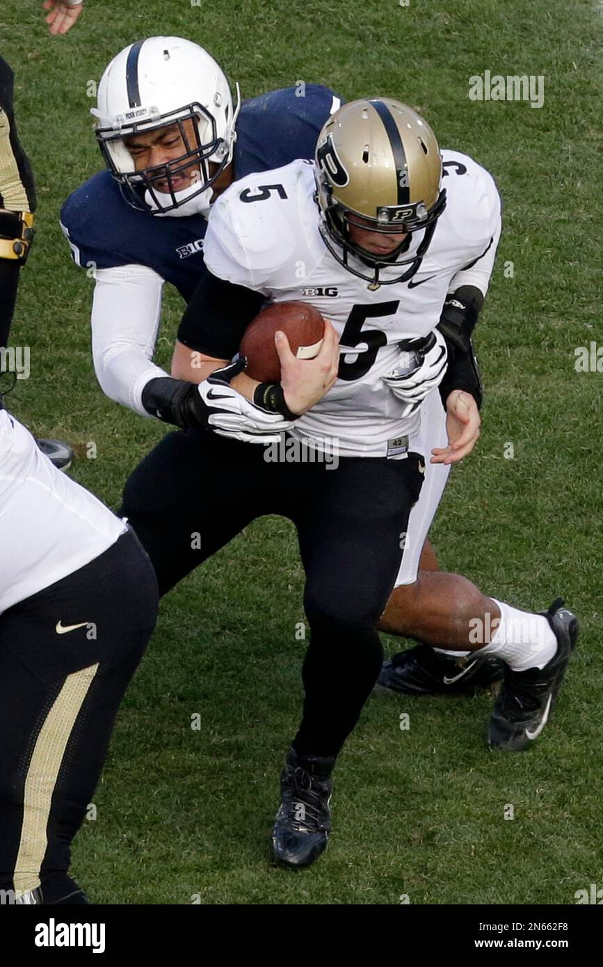 Purdue quarterback Danny Etling (5) is sacked by Penn State linebacker ...