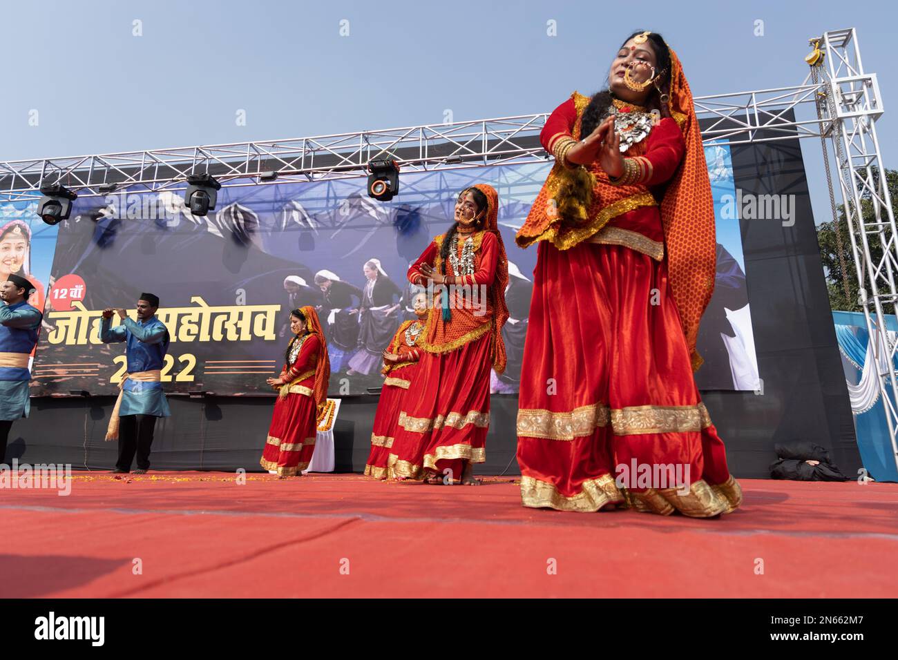 Tribal men and women wearing traditional attire dancing at the Johar ...