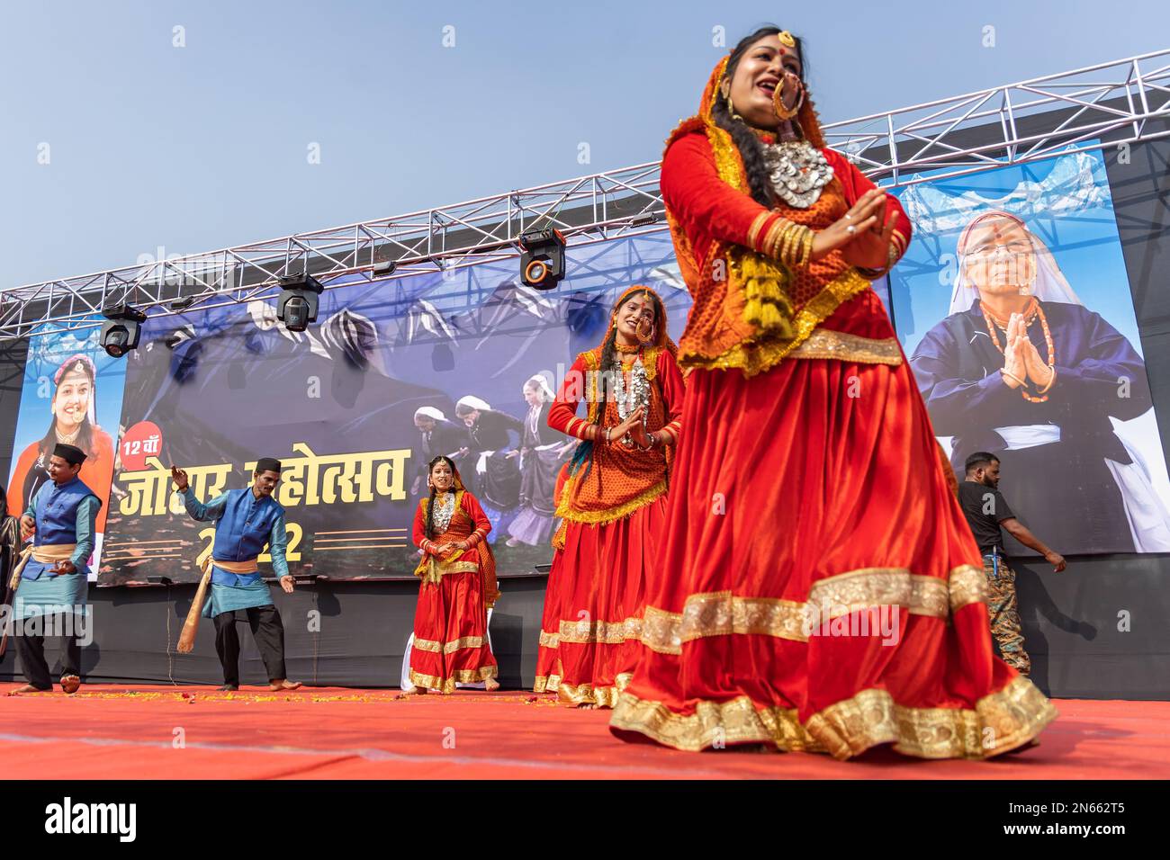 Tribal men and women wearing traditional attire dancing at the Johar ...