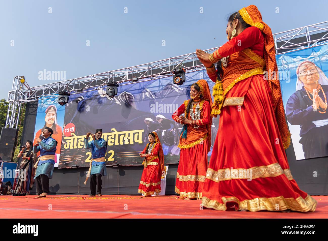 Tribal men and women wearing traditional attire dancing at the Johar ...