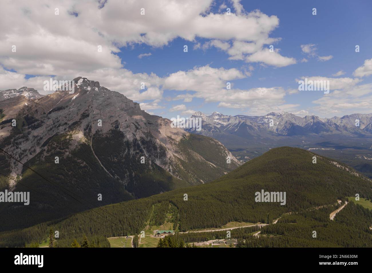 Mountain landscape - coniferous forest, beautiful blue sky with clouds ...