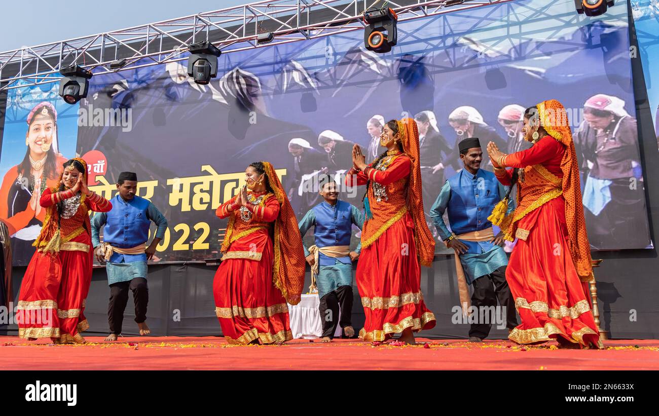 Tribal men and women wearing traditional attire dancing at the Johar ...