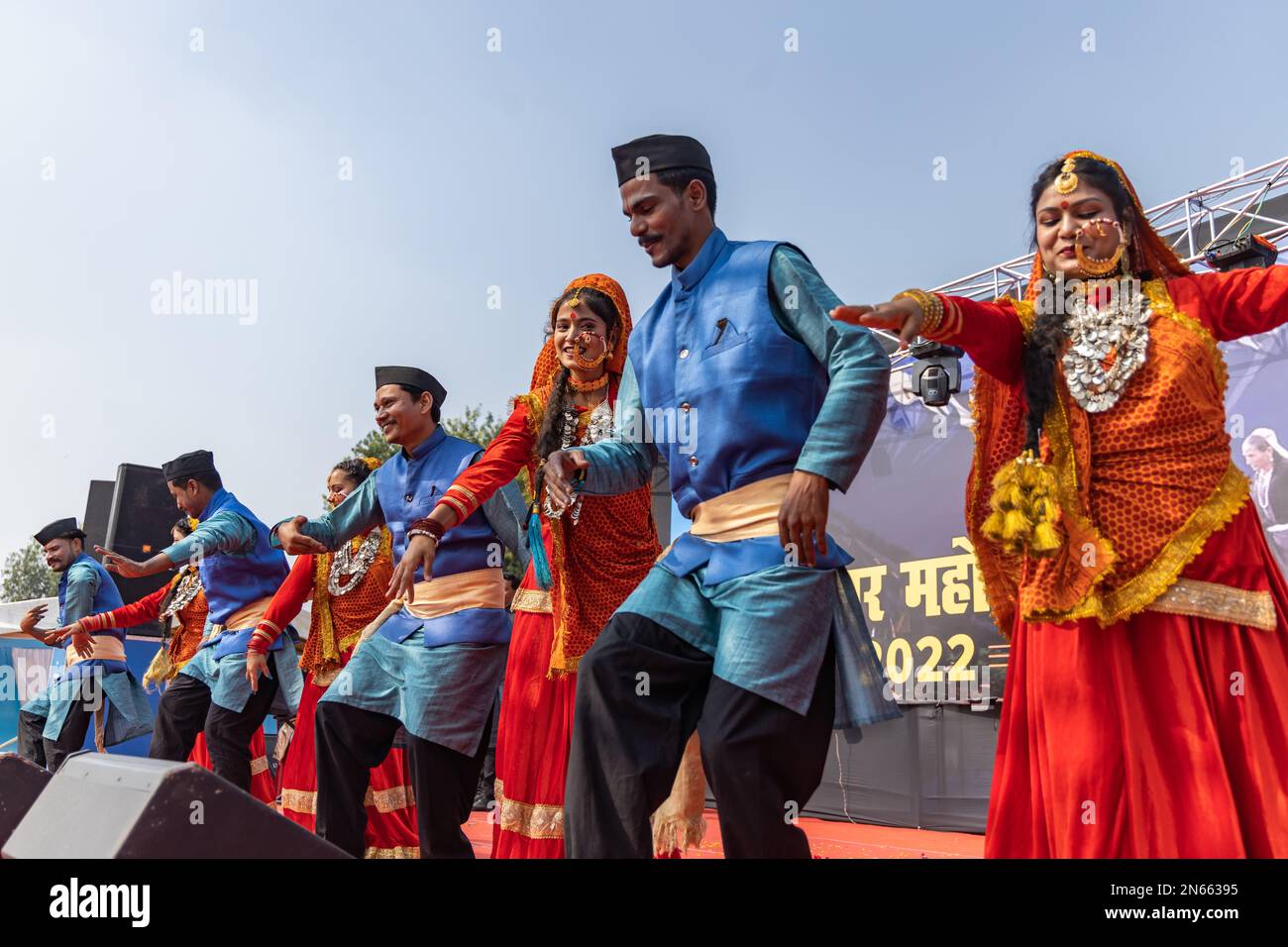 Tribal men and women wearing traditional attire dancing at the Johar ...