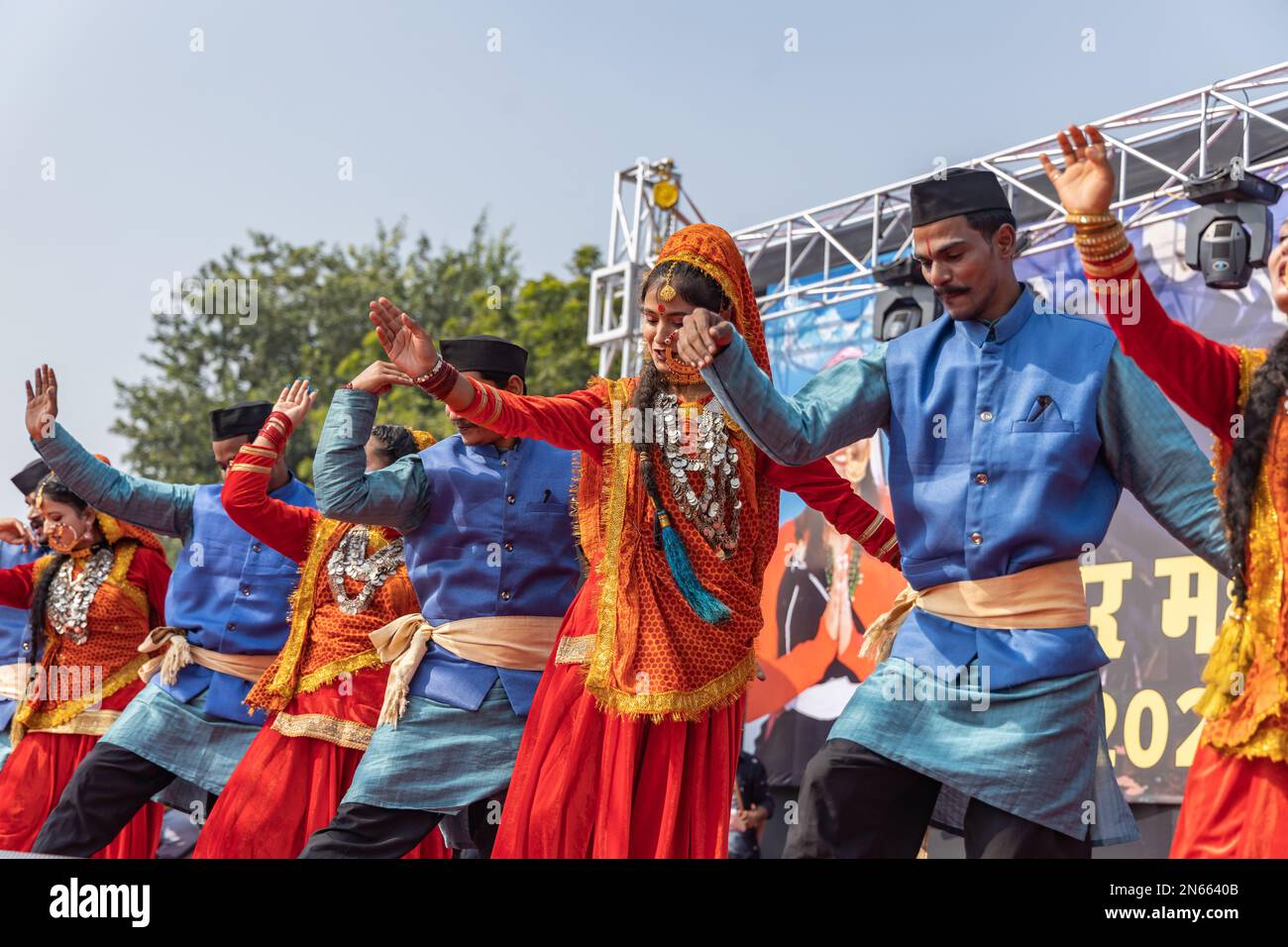 Tribal men and women wearing traditional attire dancing at the Johar ...