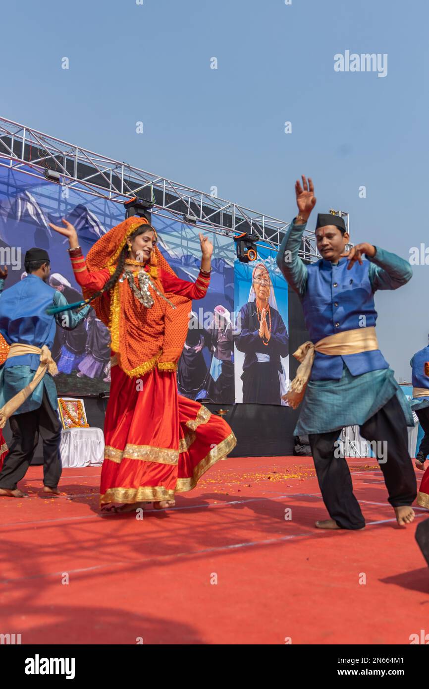 Tribal men and women wearing traditional attire dancing at the Johar ...