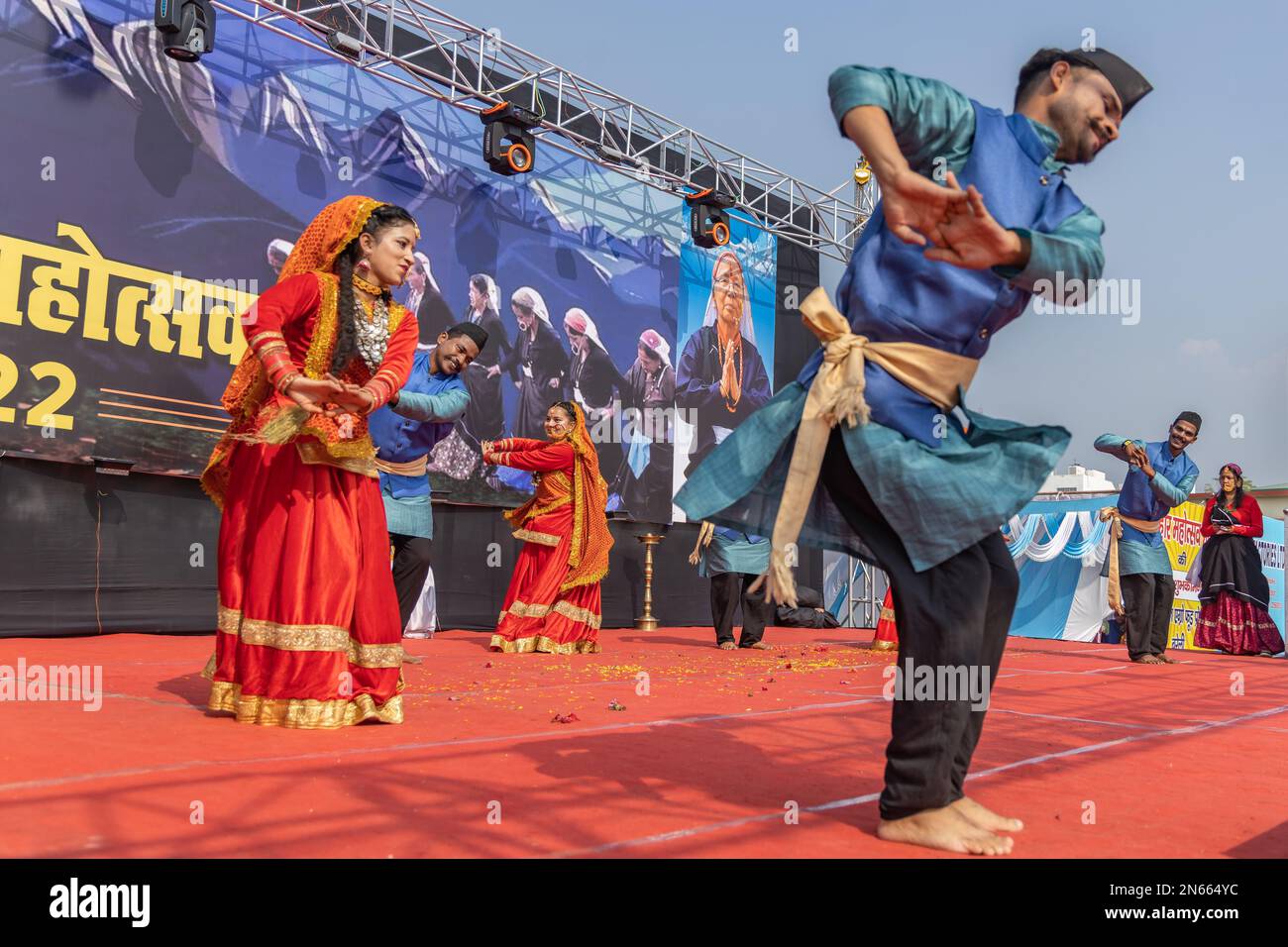 Tribal men and women wearing traditional attire dancing at the Johar ...