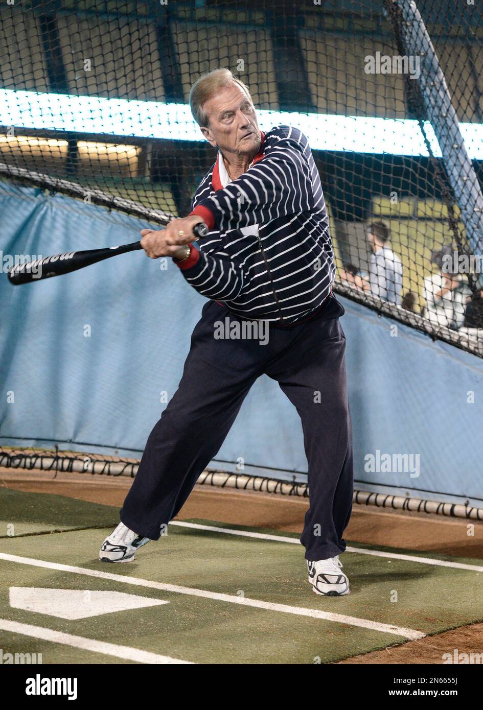 Singer Pat Boone takes batting practice at a surprise birthday party ...