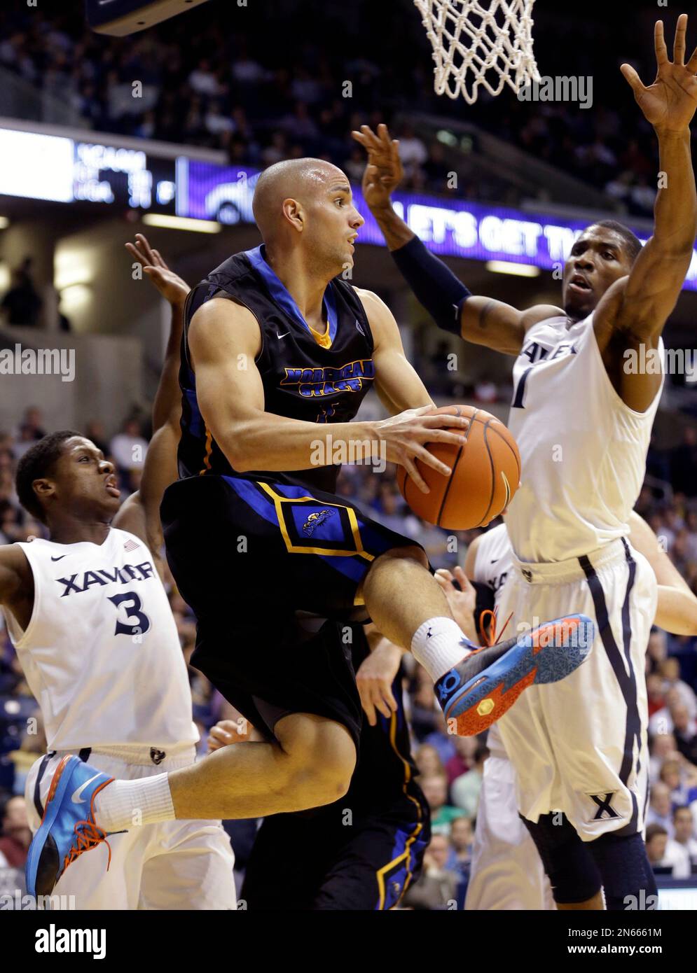 Morehead State guard Luka Pajkovic drives between Xavier guard Brandon ...