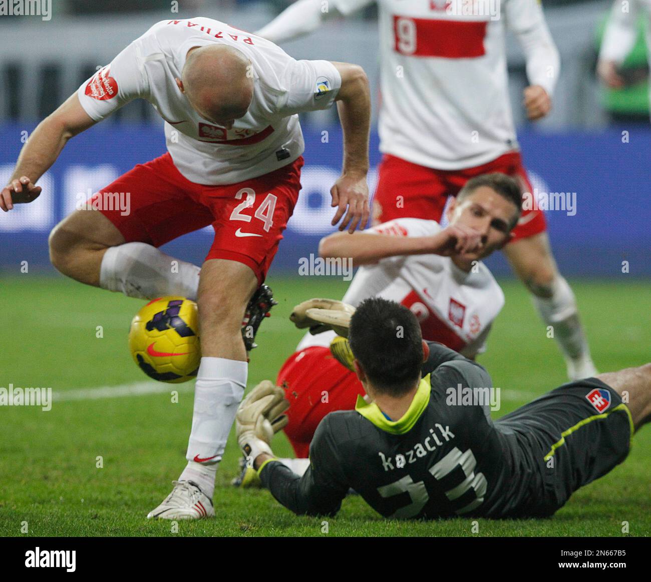 Poland's Michal Pazdan, left, and Marcin Robak, and Slovakia's ...