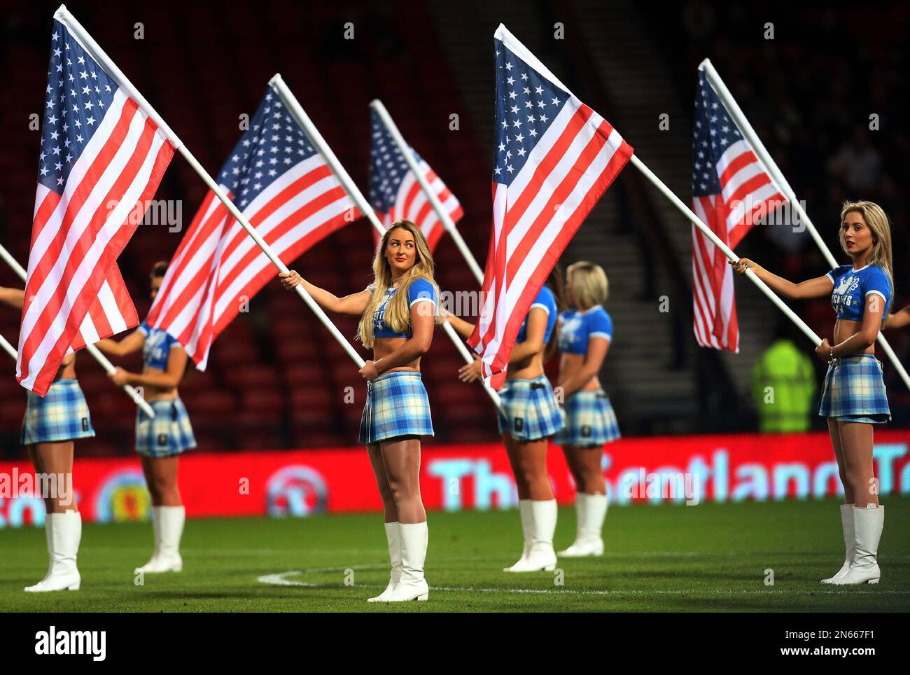 Cheerleaders wave US national flags ahead of the international soccer ...