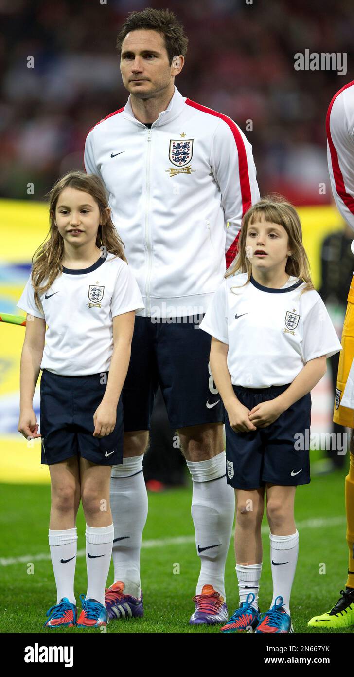 England's Frank Lampard stands with his daughters Luna, left, and Isla ...