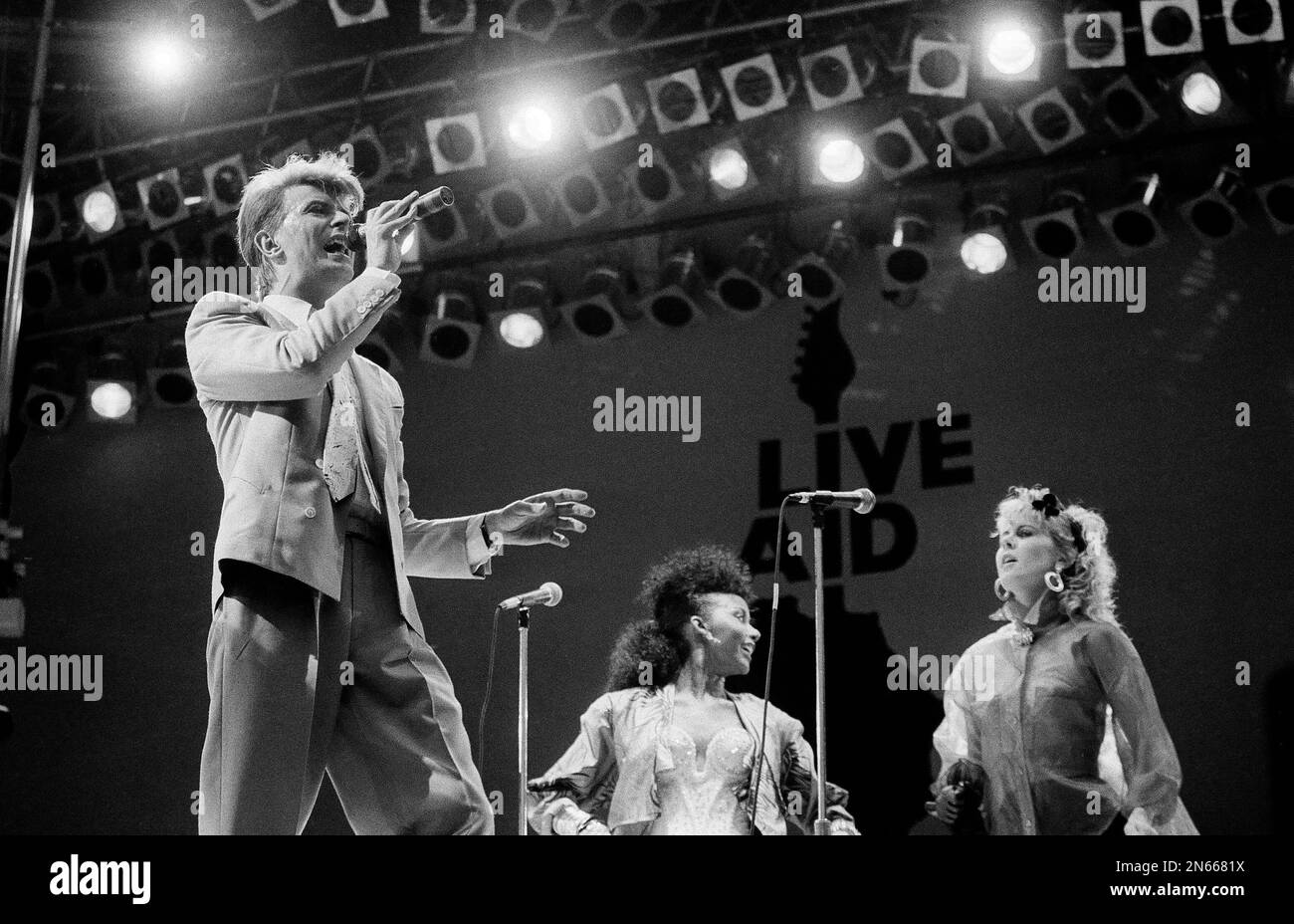 David Bowie performs on stage at London's Wembley Stadium during the ...
