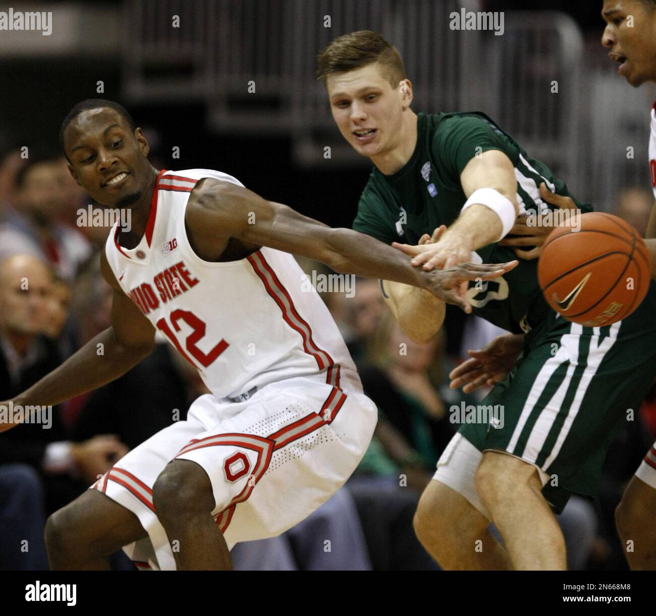 Ohio State's Sam Thompson, left, knocks the ball away from Ohio's Treg ...