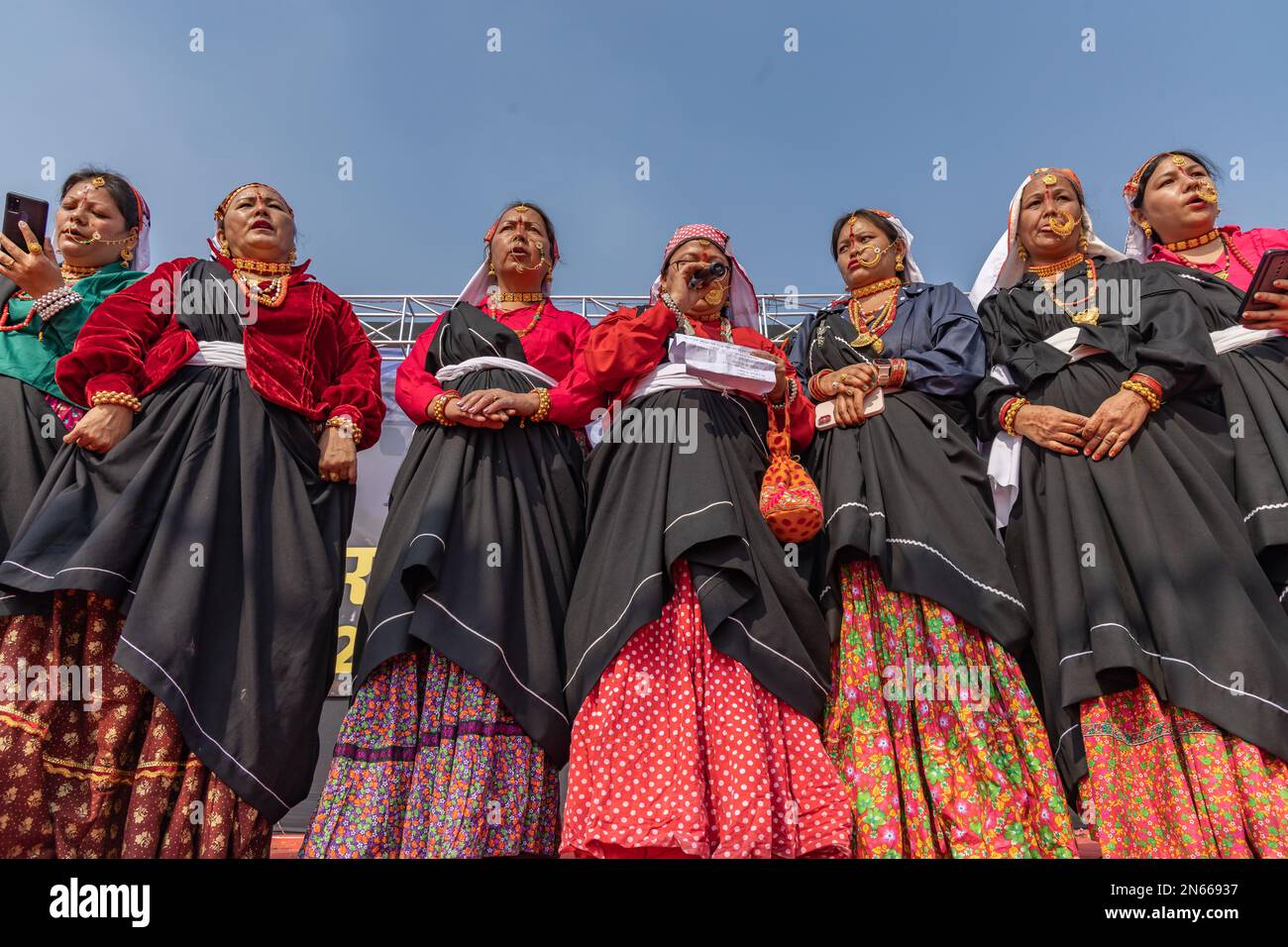 Tribal women of Uttarakhand wearing traditional attire singing folklore ...