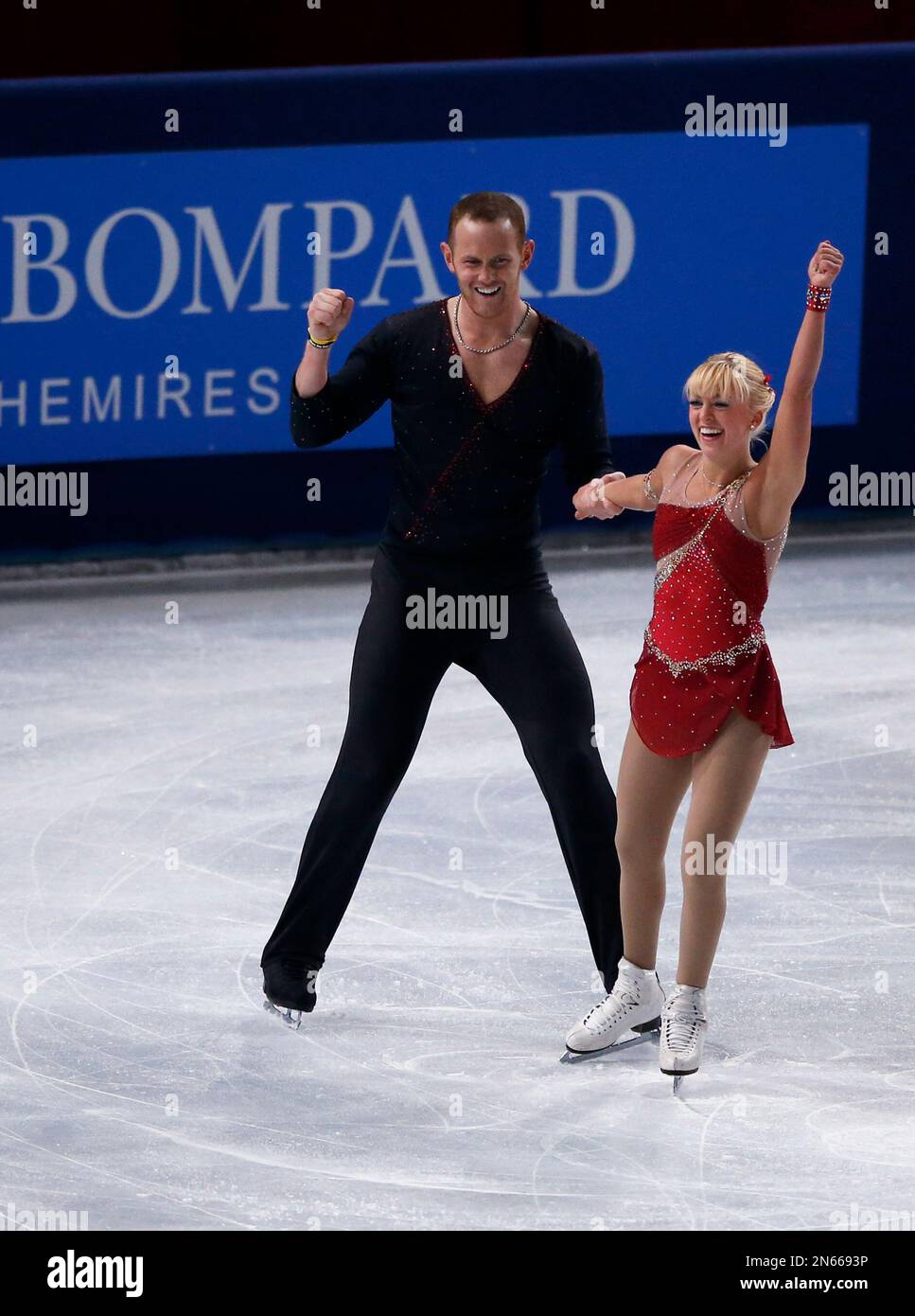 Caydee Denney and John Coughlin of the US, celebrate at the end of their Pairs Short Program ...