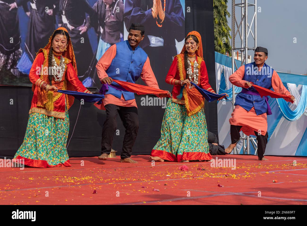 Tribal men and women wearing traditional attire dancing at the Johar ...