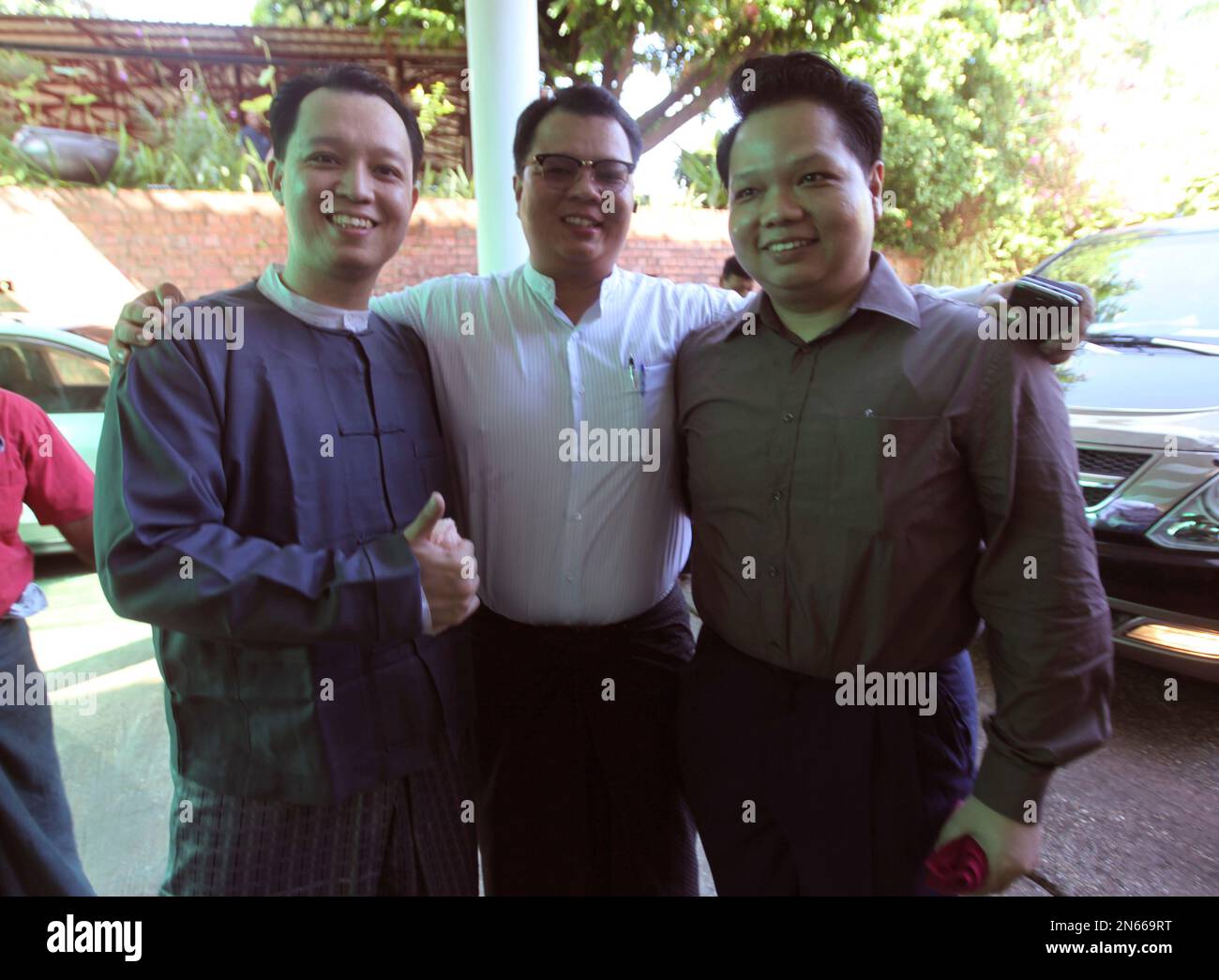 Kyaw Ne Win, left, a grandson of former dictator Gen. Ne Win, gives the ...