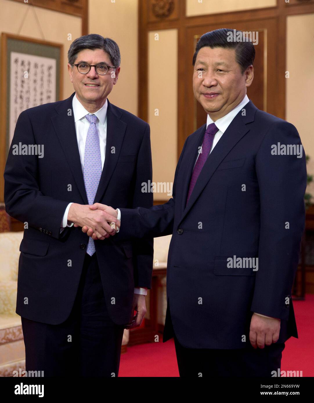 U.S. Treasury Secretary Jack Lew, left, sand Chinese President Xi ...